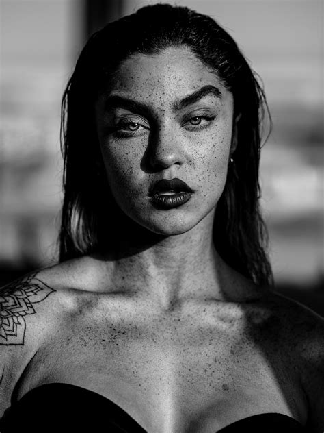 A Black And White Photo Of A Woman With Tattoos Photo Free Image On