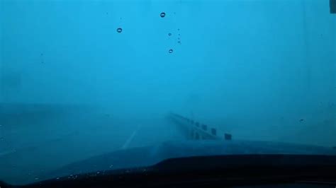 A Tornado Goes Over A Man Whose Under An Overpass Showing A Very Good Visual Of The Wind Tunnel