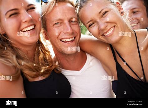 Surrounded By Sweet Smiling A Group Of Smiling Friends Enjoying Each