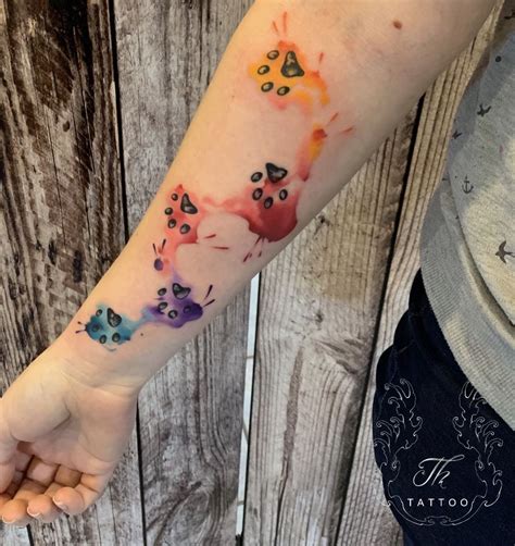23 Surprisingly Sweet Stunning Paw Print Tattoos Artofit