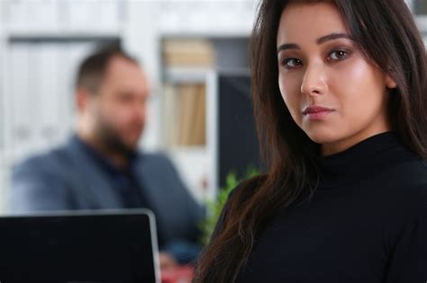 Premium Photo Young Beautiful Brunette Woman Sit At Table In Office