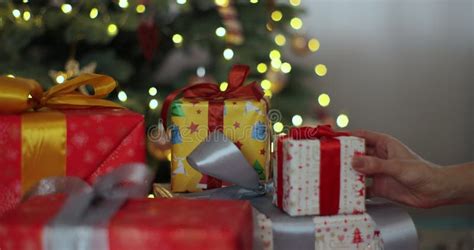 A Stack Of T Boxes With Christmas Decorations With Bokeh Lights