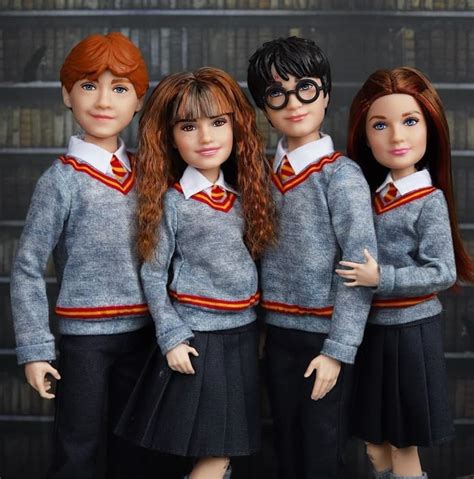 three dolls are posed next to each other in front of a bookshelf full ...