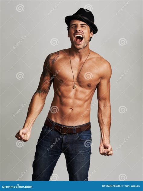 Shirtless Frustration A Shirtless Young Man Wearing A Hat And