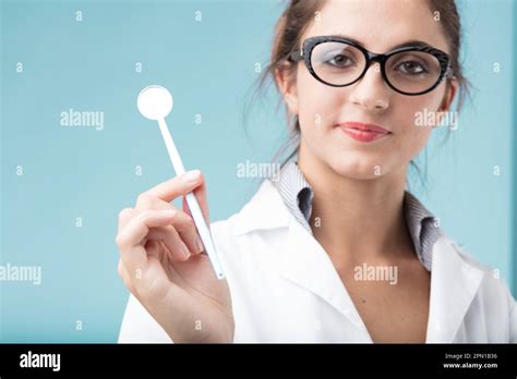 The Dentist Recommends Getting Regular Dental Checkups She Holds A