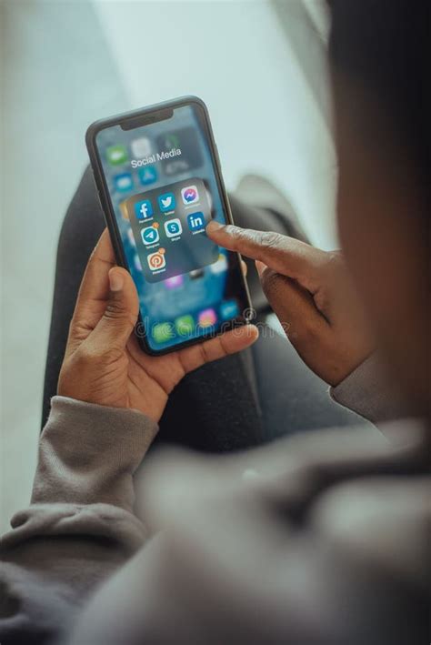 An Iphone With Multiple Different Types Of App Icons Is Shown In The