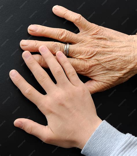 Premium Photo Old Woman39s Hand And Young Man Hand Touching Her