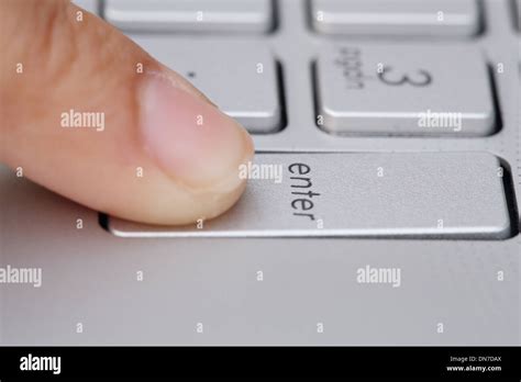 Close Up Finger Pushing The Enter Button Of Keyboard Stock Photo Alamy