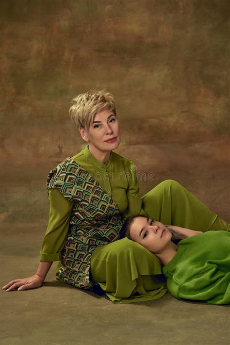 Portrait Of Happy Middle Aged Woman Mother With Her Young Daughter