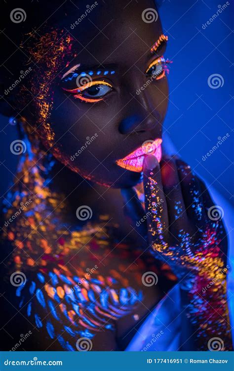Beautiful Extraterrestrial African Model Woman In Neon Light Stock