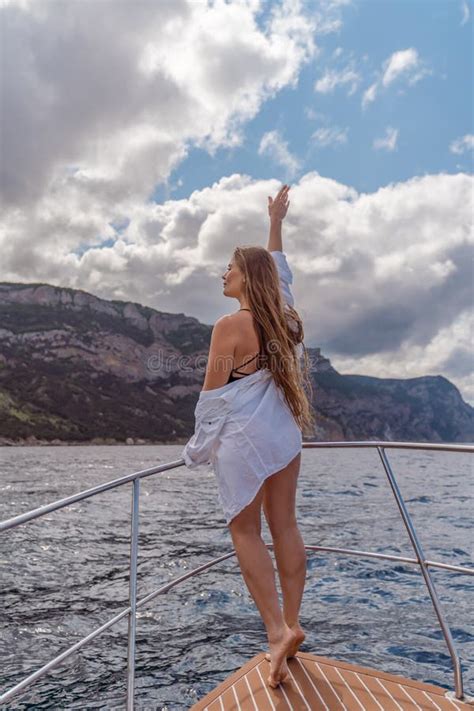Woman On A Yacht Happy Model In A Swimsuit Posing On A Yacht Against A