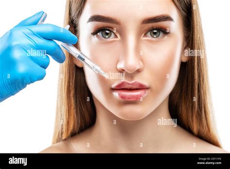 Cosmetologist Does Injections For Lips Augmentation Anti Wrinkle Injections On The Face Of A