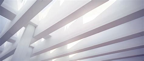 Sunlight Filters Through A Contemporary Structure With Angled Beams