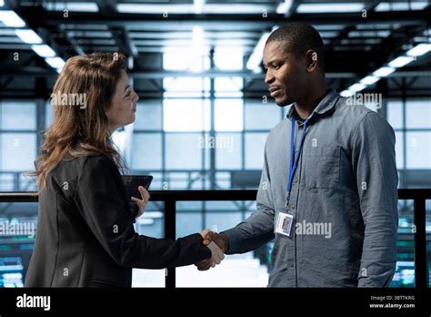 Manager Meeting With Computer Scientist In Data Center Coming To Inspect Servers Supervisor