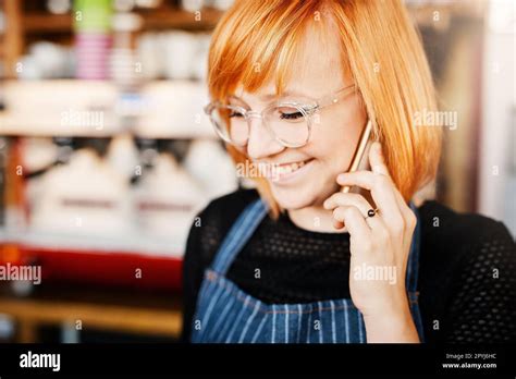 Clients Always Call To Say Hi A Shop Assistant Talking On Her