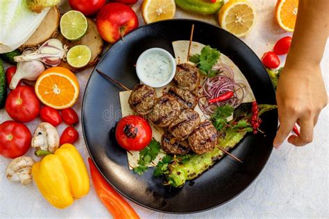 Kebab With Pita Bread And Grilled Vegetables On A Decorated Table Stock