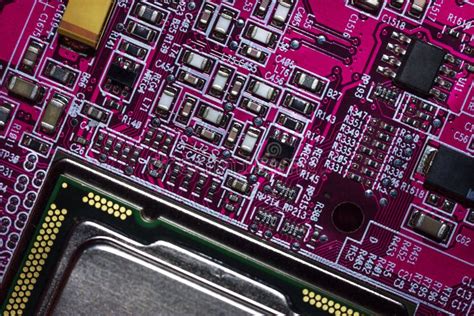 Close Up Of A Red Electronic Printed Circuit Board PCB With Semiconductor Strips Between A