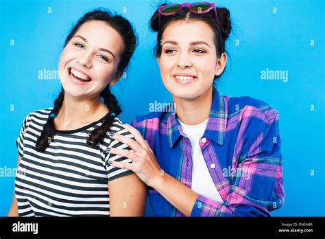 Best Friends Teenage School Girls Together Smiling Having Fun Posing Emotional On Blue