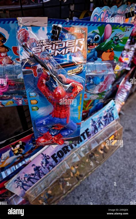 Bootleg Toy Stand Featuring A Spider Man Figure Holding A Rifle In A