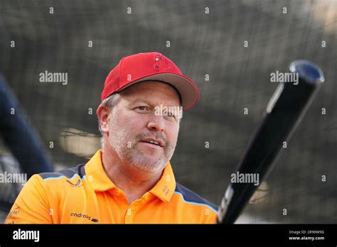 CEO Of McLaren Racing Zak Brown Holds A Baseball Bat During A Workout
