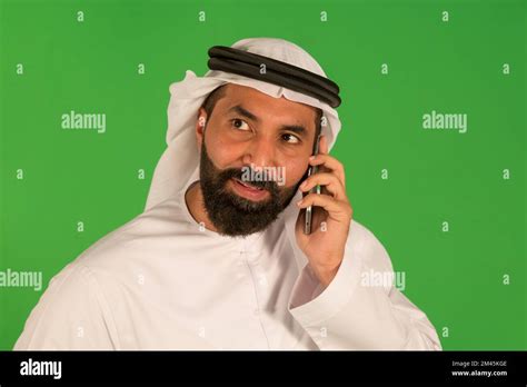 Emirati Man Talking On A Mobile Phone Stock Photo Alamy