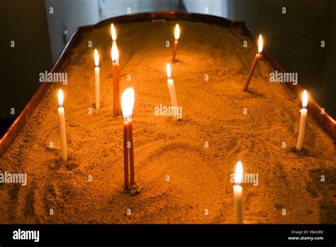 Candles Burning Over Dark Background In A Church Stock Photo Alamy