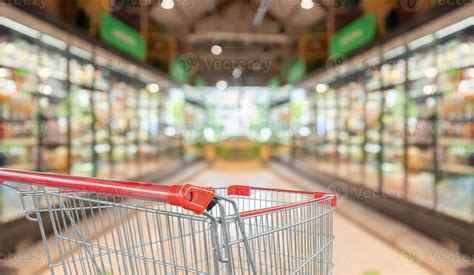 Empty Shopping Cart In Supermarket Grocery Store Background 13053128