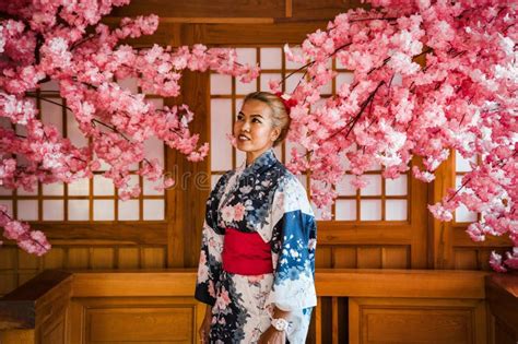 Asian Girl In Kimono And Umbrella In Japanese Theme Park Hinoki Land In