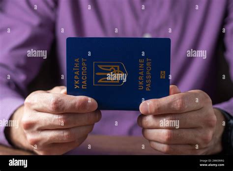 New Ukrainian Blue Biometric Passport With Identification Chip In Hands
