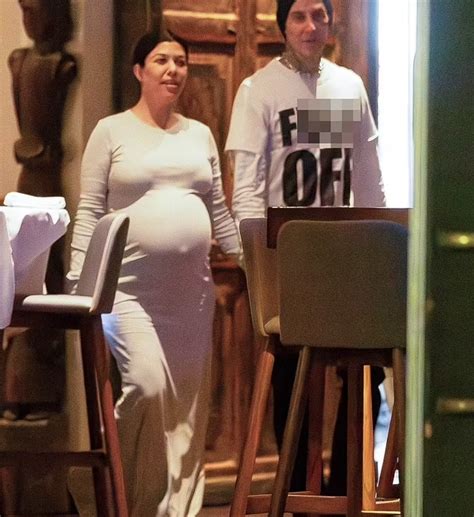 Kourtney Kardashian Shows Off Her Huge Baby Bump While Holding Hands