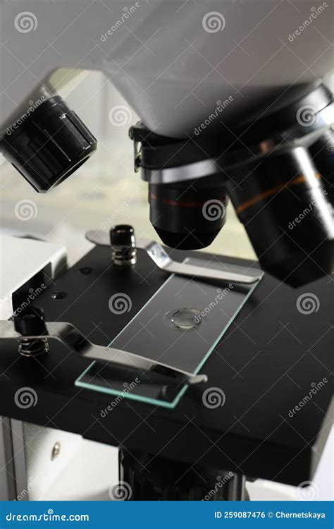 Microscope With Drop Of Urine On Glass Slide In Laboratory Closeup