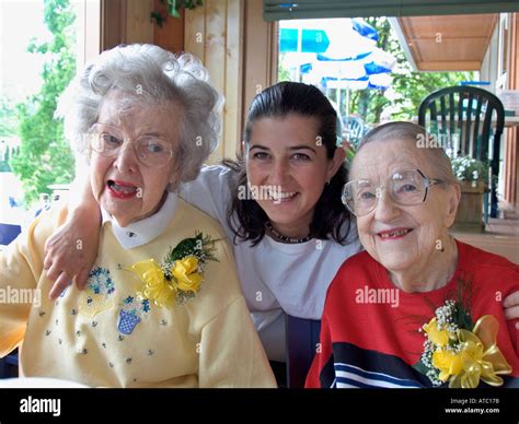 Two 90 Year Old Old Maid Aunts And Their Niece At A Restaurant Celebrating 90th Birthday Stock