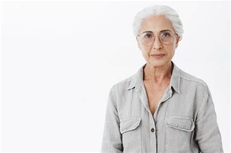 Free Photo Beautiful Senior Woman In Glasses Smiling White Background