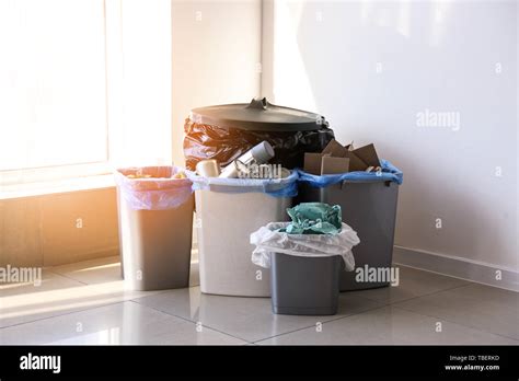 Trash Bins With Different Types Of Garbage Indoors Stock Photo Alamy