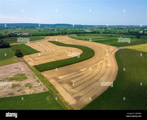 An Aerial View Of The Patchwork Fields In The Rural Countryside Stock