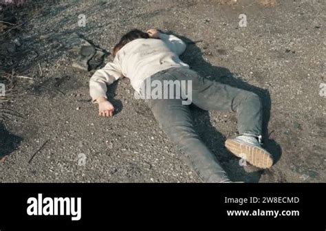 Dead Teenage Girl In A White Sweater On The Road Killed By A Maniac In The News Corpse Face Down