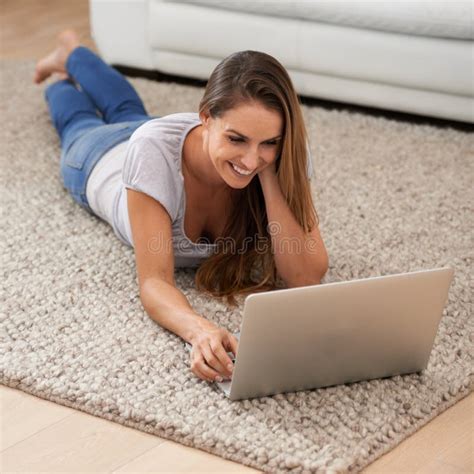 Daily Dose Of Social Networking A Woman Lying On Her Living Room Floor