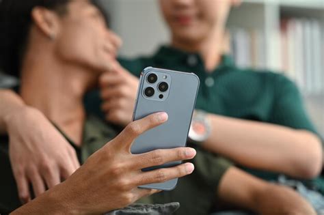 Premium Photo Select Focus On Hands Of Man Using Smartphone While Relaxing On Couch With