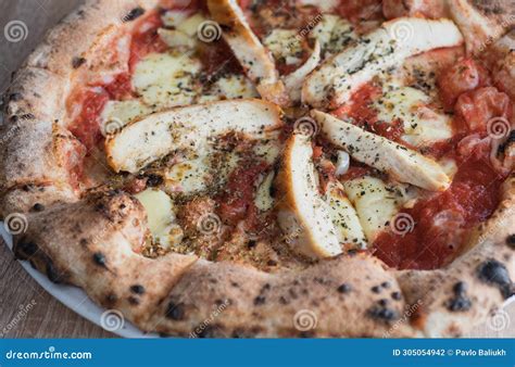 Pizza With Chicken And Tomato Sauce From A Neapolitan Wood Fired Oven