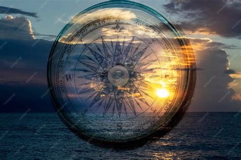Premium Photo Compass On The Background Of The Sunset Over The Ocean