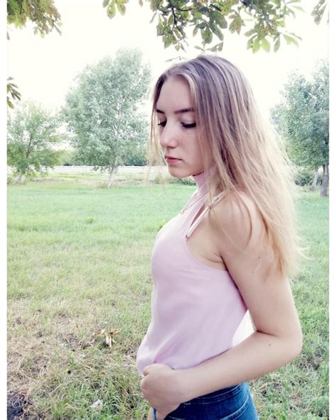 Premium Photo Side View Of Beautiful Woman Standing At Park