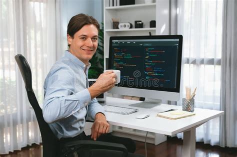 It Developer Looking Camera Holding Coffee Cup With Coding On Pc