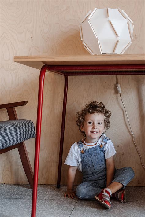 Inquisitive Baby Crawling Under Table At Hone By Stocksy Contributor Alina Hvostikova Stocksy