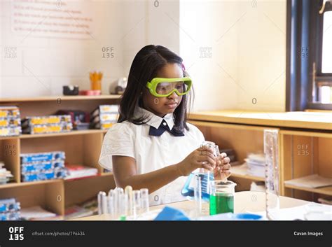 Babe Girl Doing A Science Experiment In Class Stock Photo OFFSET