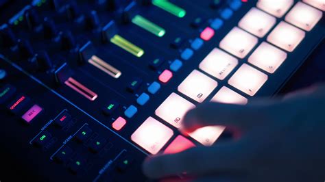 Professional Dj Plays A Beat Sampler With Color Drum Pads And Samples