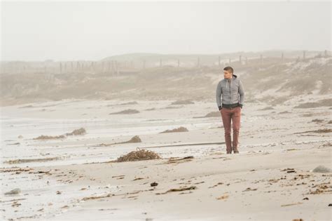 Premium Photo Lone Man At Usa Pacific Coast Beach