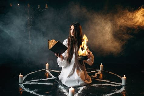 Premium Photo Young Woman In White Shirt Sitting In The Center Of Pentagram Circle With