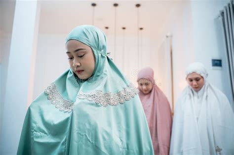 Muslim Women Wearing Muslim Clothes With Hijab Praying In Congregation