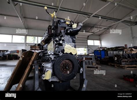 A Disassembled Diesel Truck Engine Block Stands In A Repair Shop Or