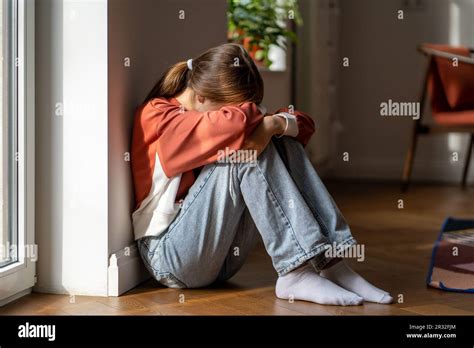 A Girl Sitting Alone And Crying